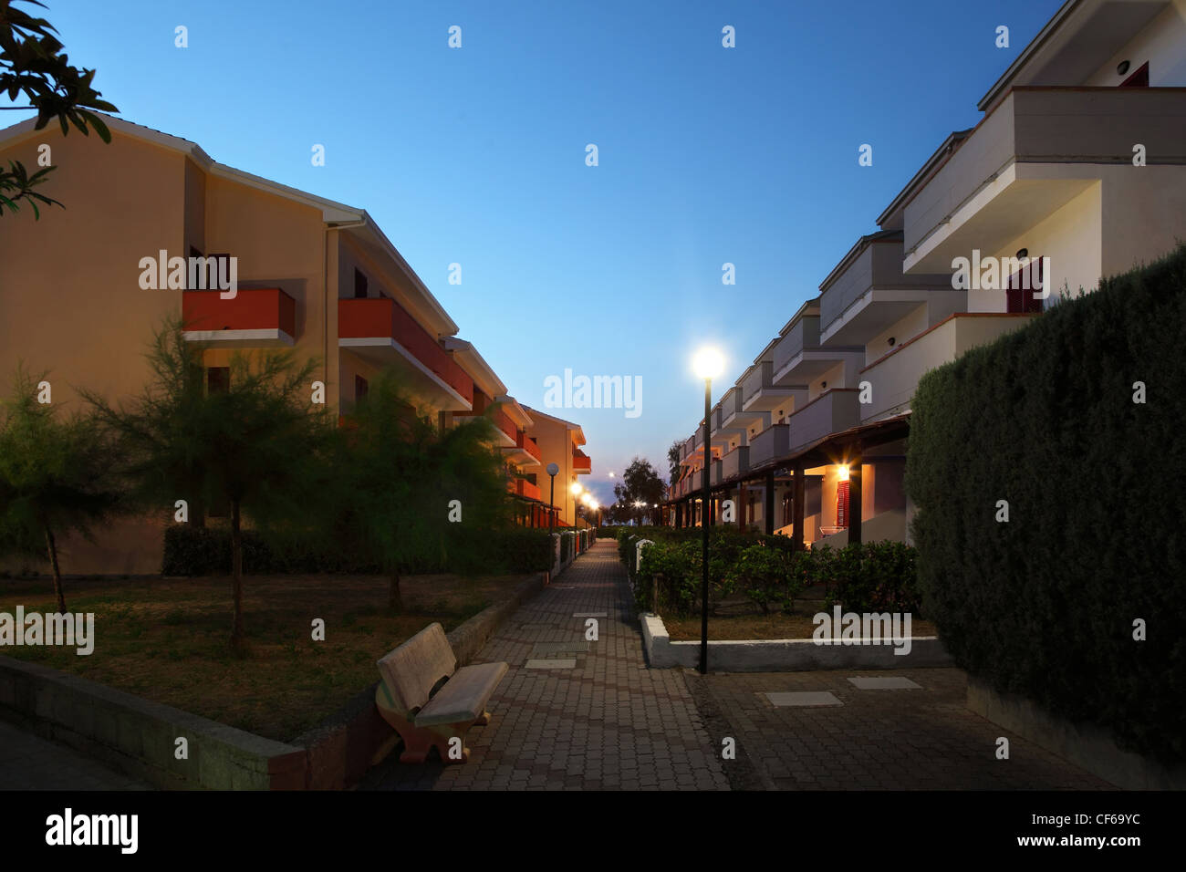 Little street between cottages in evening in summer Stock Photo - Alamy