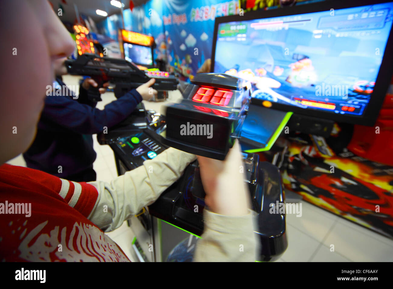 Hands of boys playing video games, they hold joystick in front of the ...
