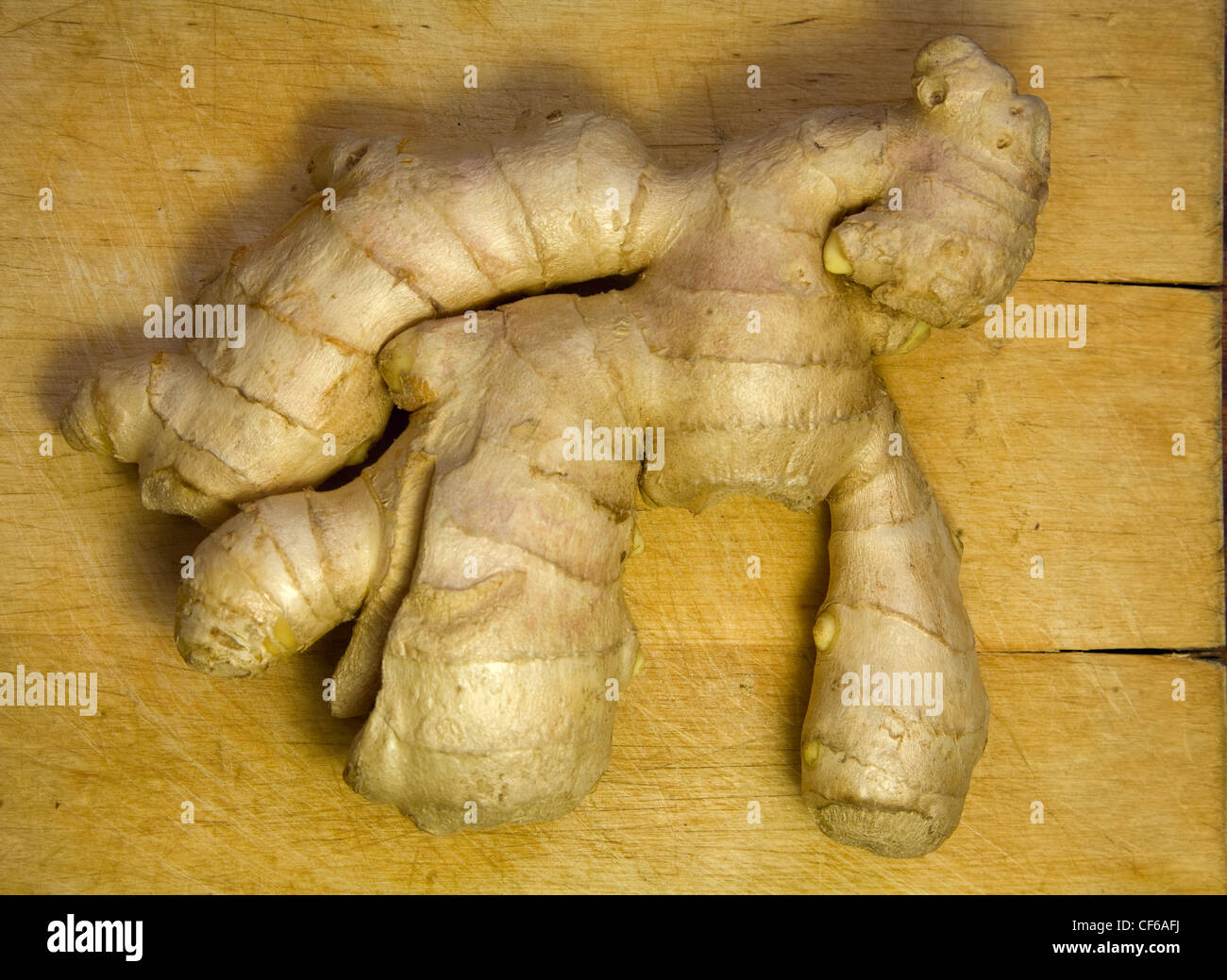 raw ginger root on wooden background Stock Photo - Alamy