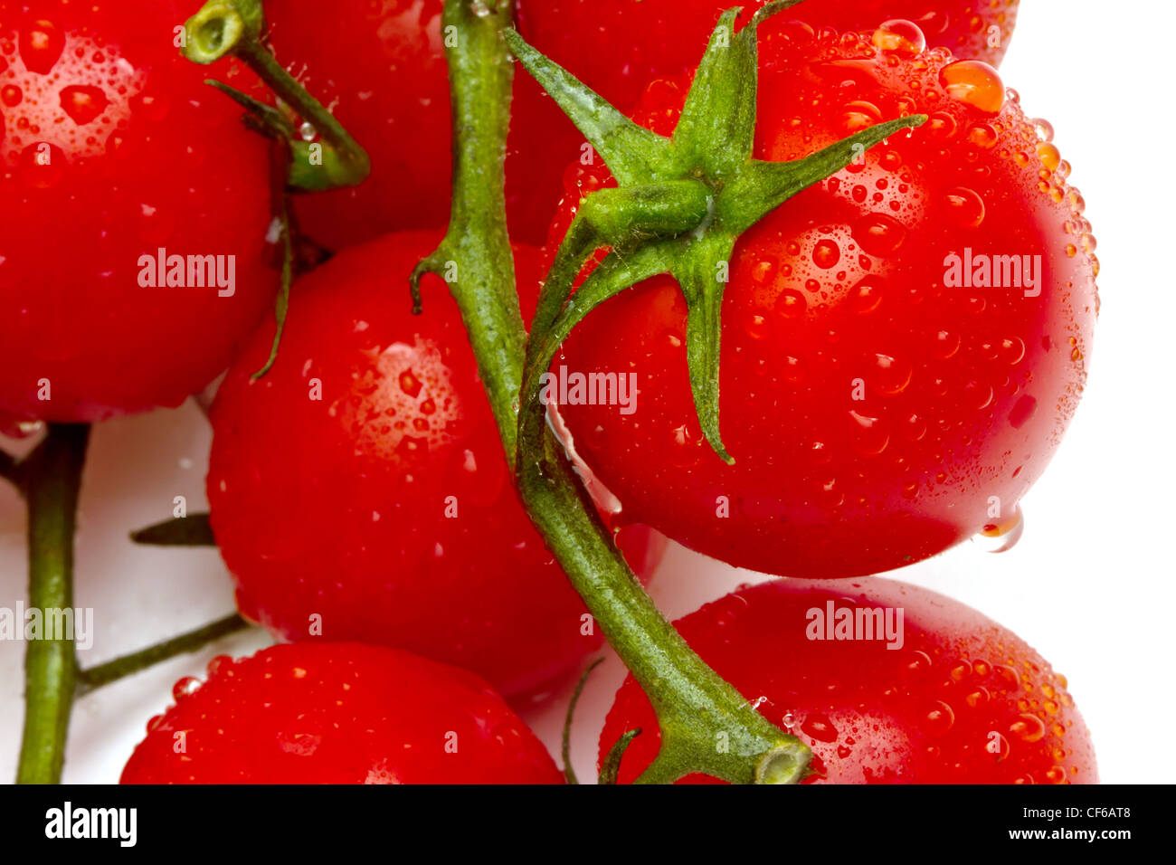 Ripe cherry tomatoes on white background Stock Photo - Alamy