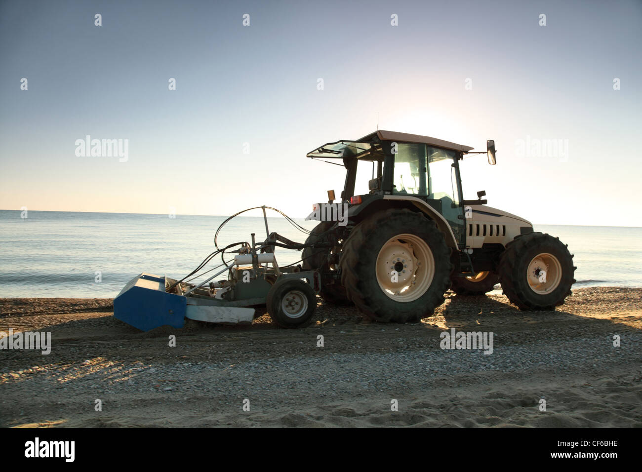 Tractor cleaning sand on beach hi-res stock photography and images - Alamy