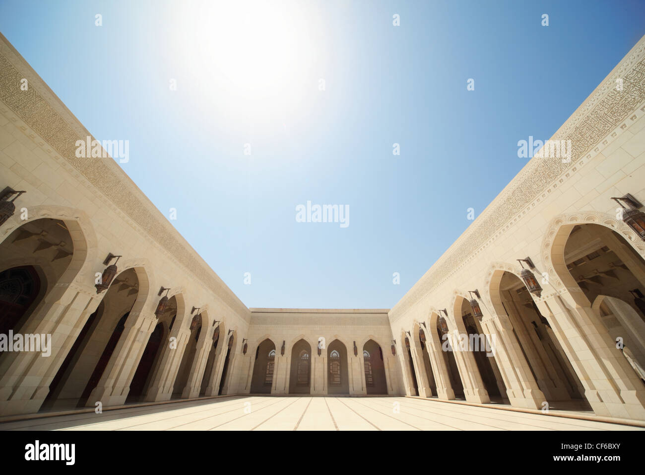 building with arcs inside Grand Mosque in Oman. Wide Angle Stock Photo ...