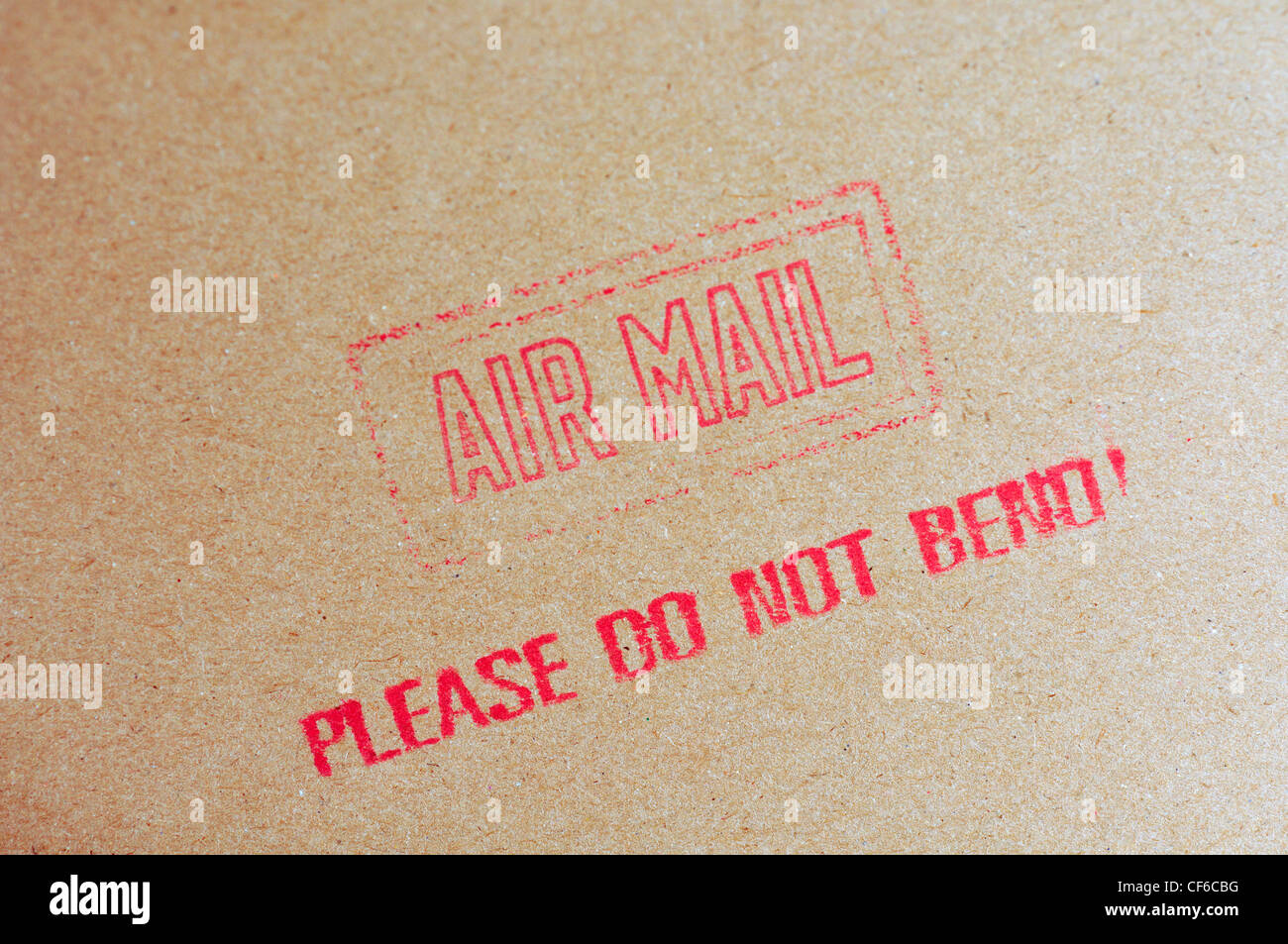 Air Mail stamp on package Stock Photo - Alamy