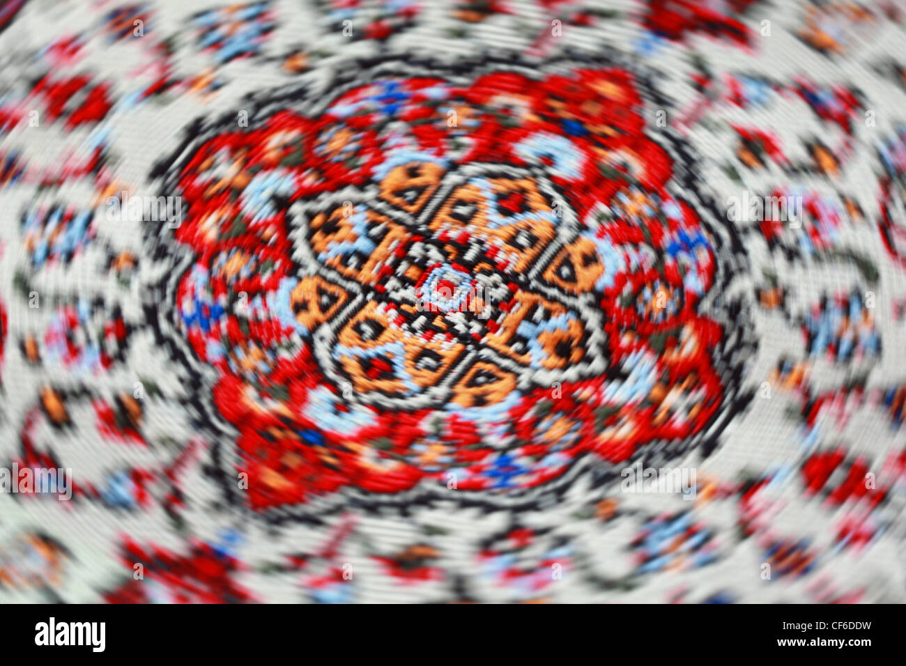 Large bright pattern on oriental carpet during rotation Stock Photo - Alamy