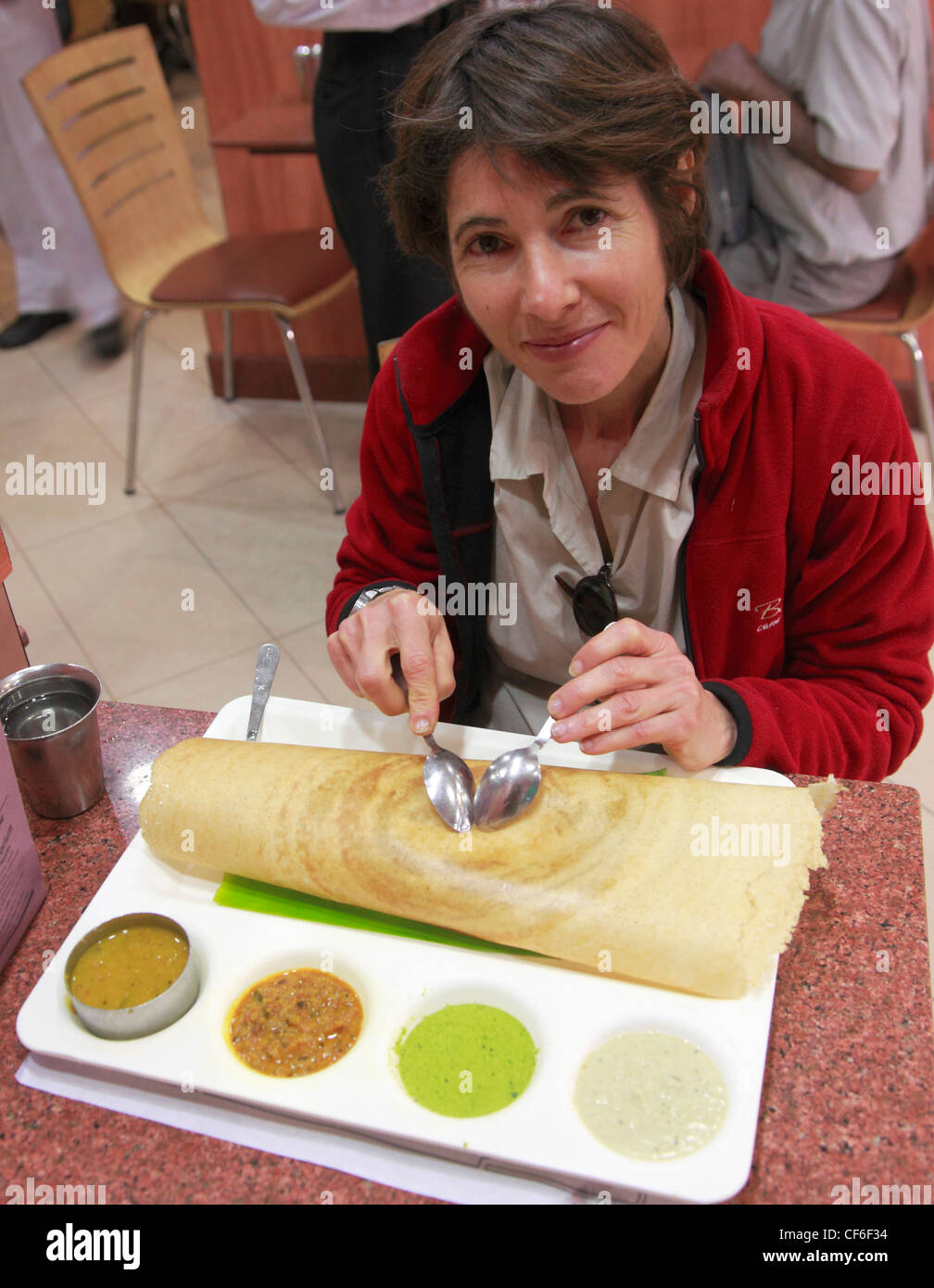 India, Delhi, western tourist eating masala dosa Stock Photo - Alamy