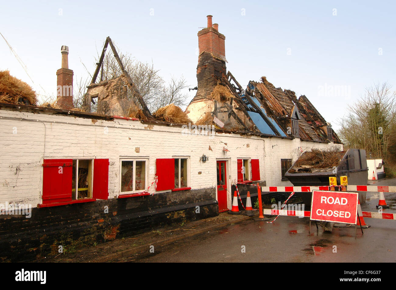 A fire damaged, old building with road closed and evidence of ...