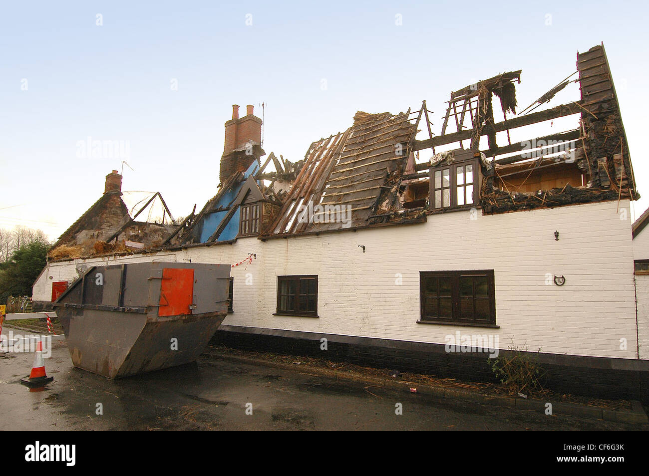 A fire damaged, old building with road closed and evidence of ...