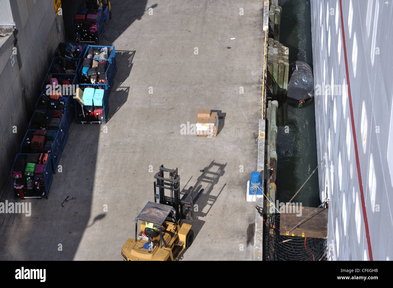 Loading passengers' luggage on cruise ship Stock Photo - Alamy