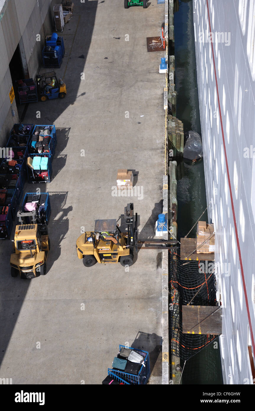 Loading passengers' luggage on cruise ship Stock Photo - Alamy