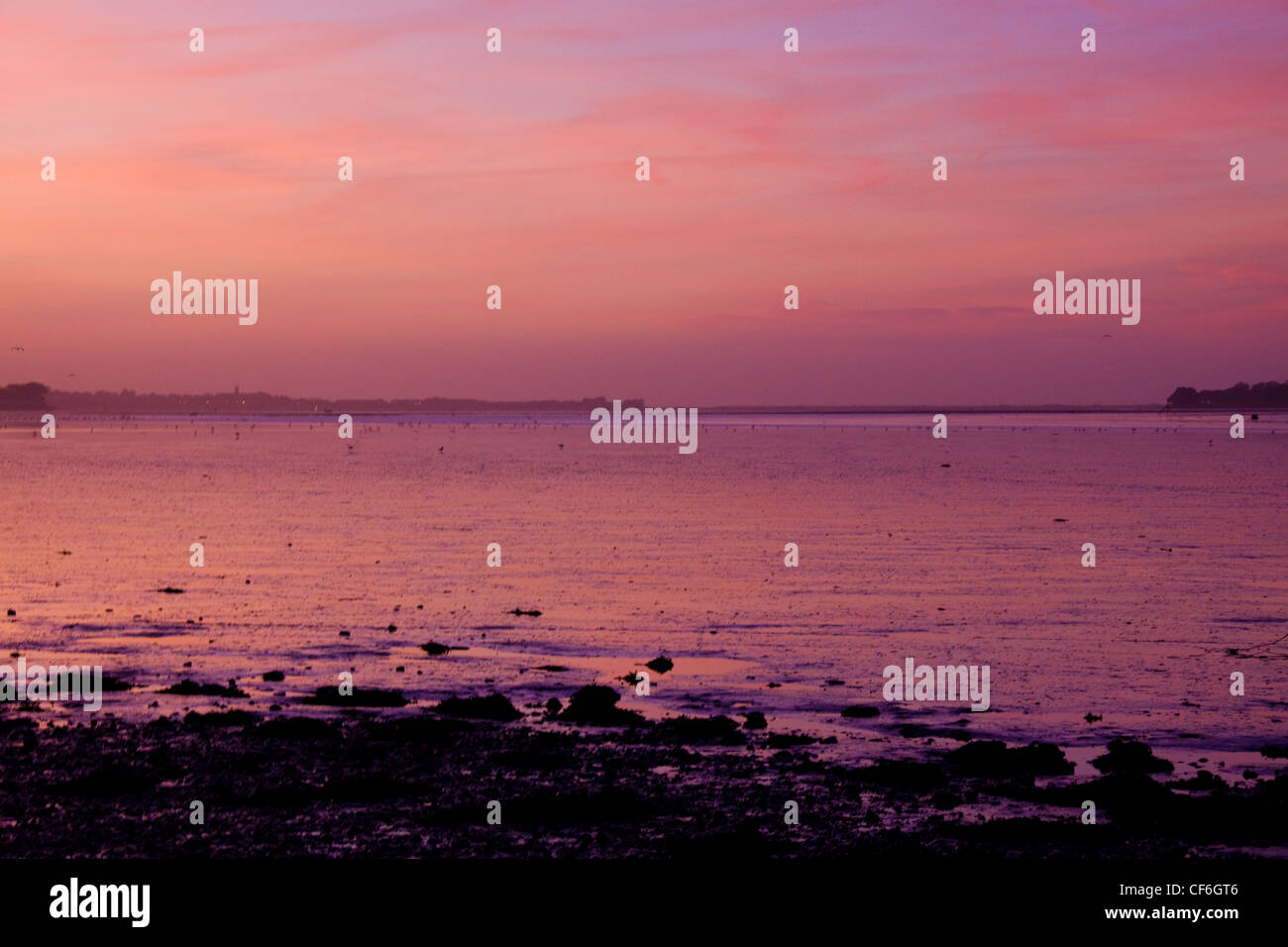 Sunrise over the water Stock Photo - Alamy