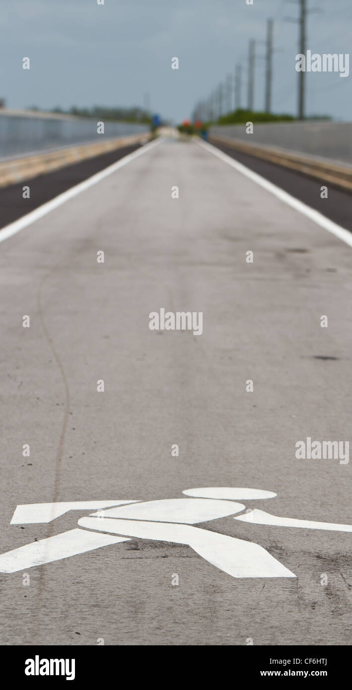 a pedestrian walking path, on a long road (represents a journey ...