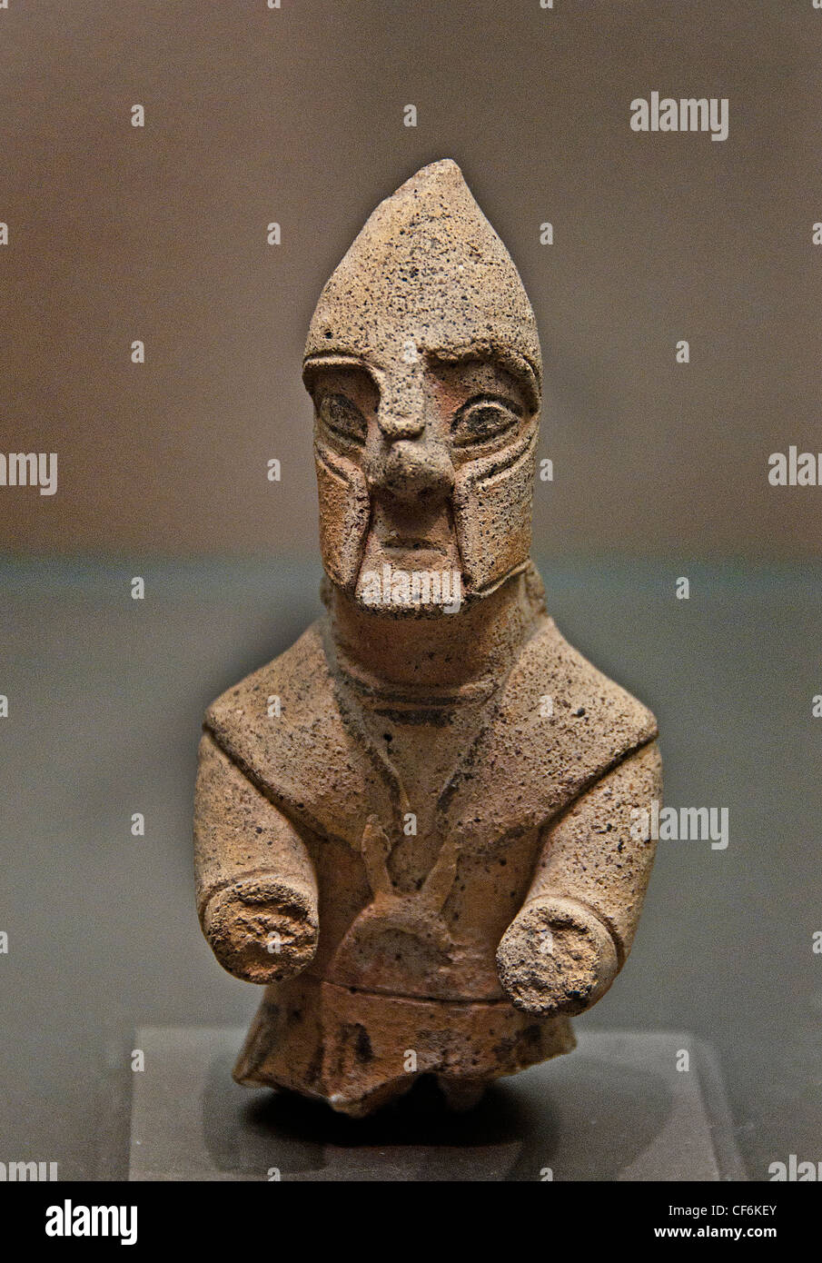 Warrior with a circular shield wearing a helmet Clay Cypro - Archaic ...
