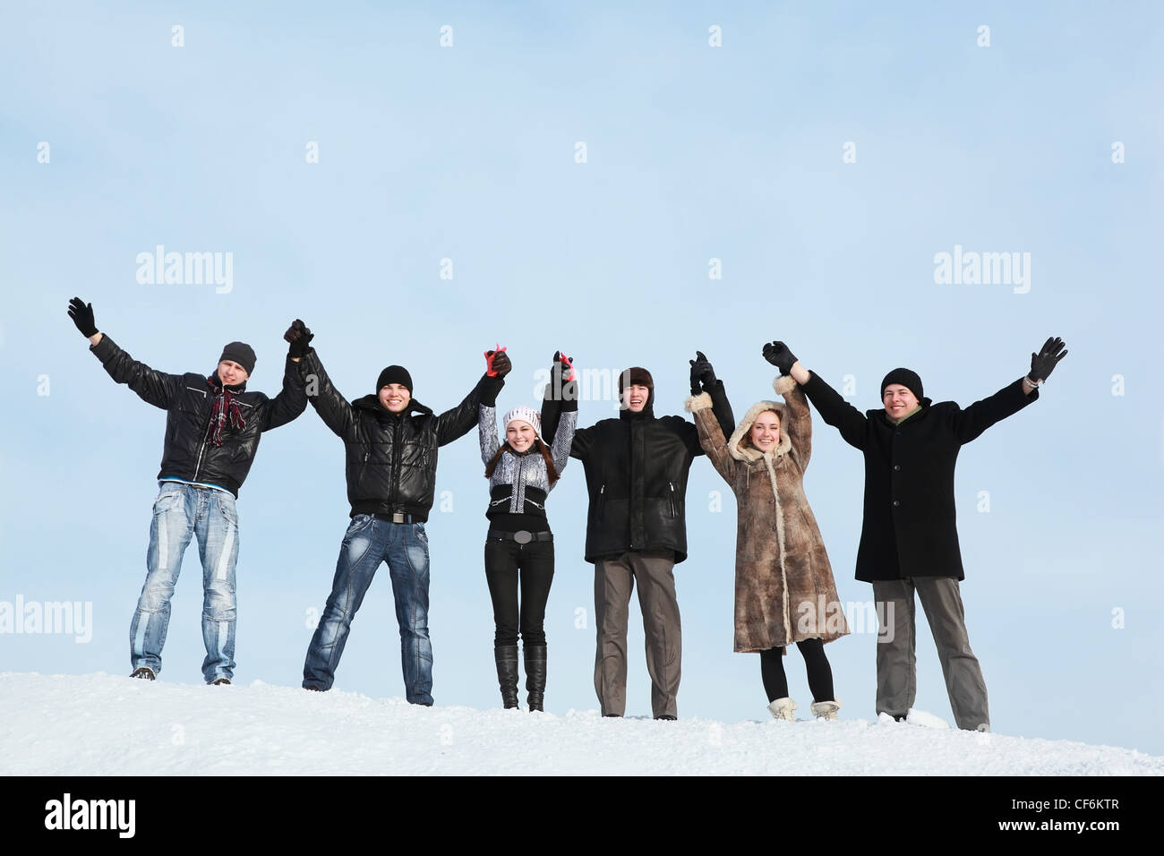 Six young people hold on hands and lift them upwards Stock Photo - Alamy