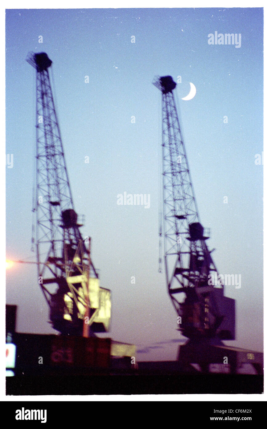 Dockside lattice gantry cranes in Goole Docks with crescent moon in ...