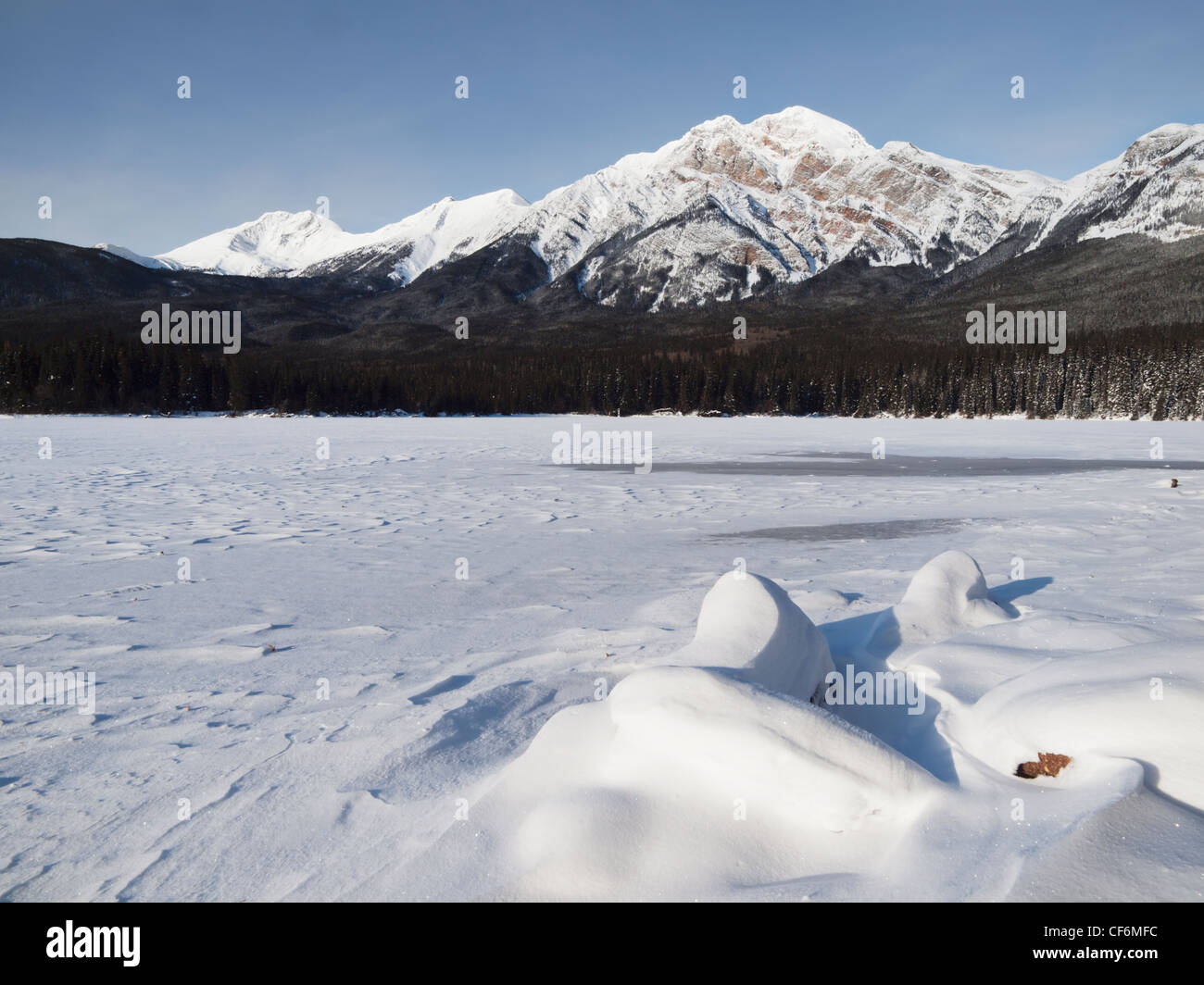 Pyramid Mountain Behind A Frozen Pyramid Lake In Winter; Jasper Alberta ...