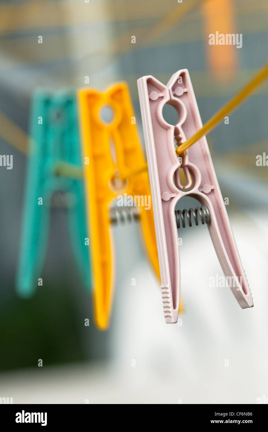 Pegs on a clothes line in British garden Stock Photo - Alamy