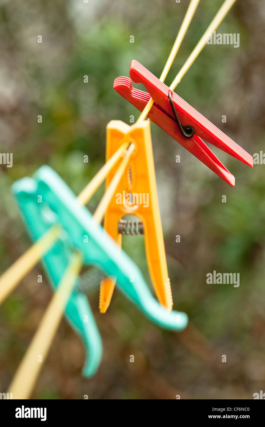 Pegs on a clothes line in British garden Stock Photo - Alamy
