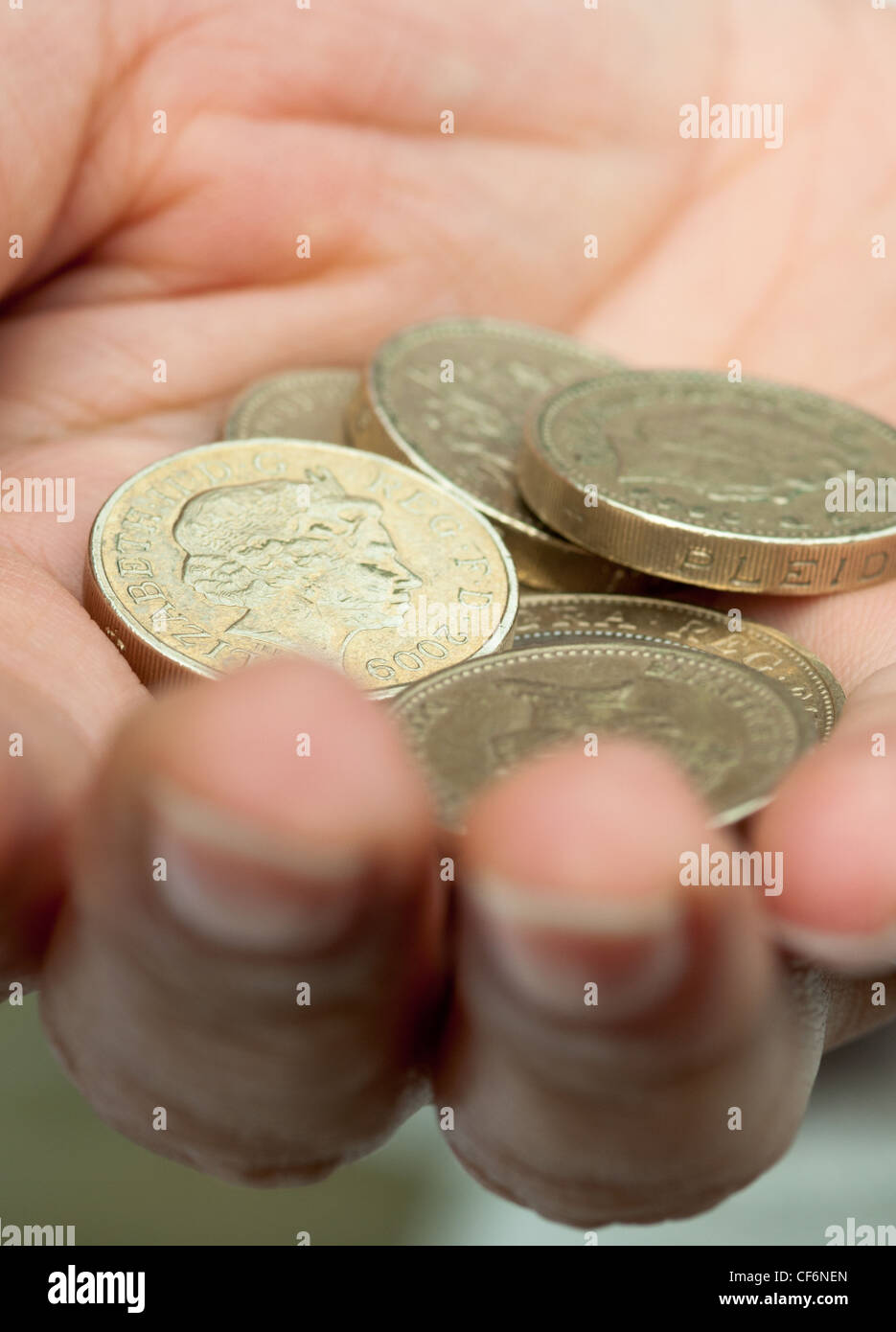 Close up hand giving coins hi-res stock photography and images - Alamy