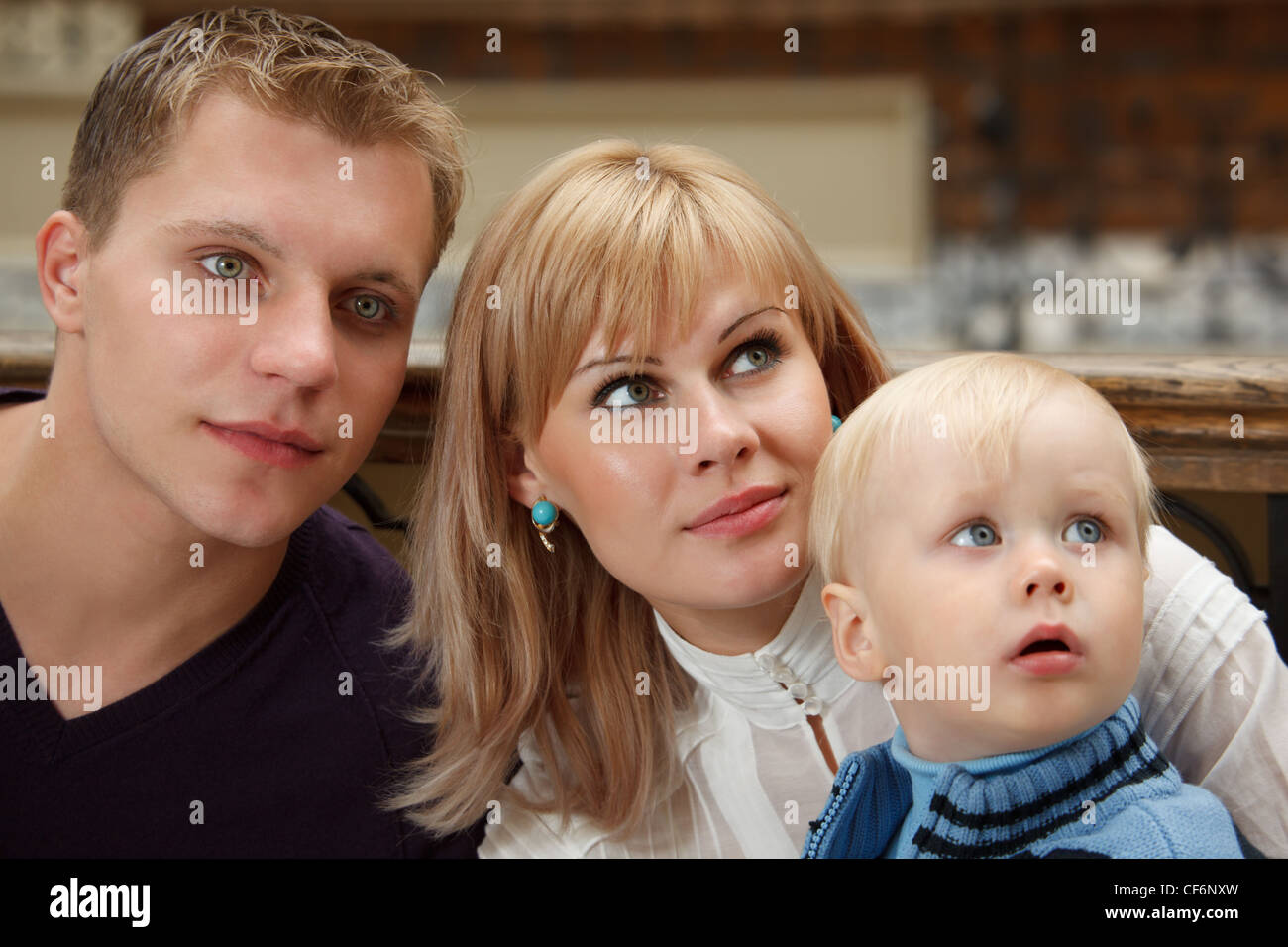 Family of three people close up. Look to right Stock Photo - Alamy