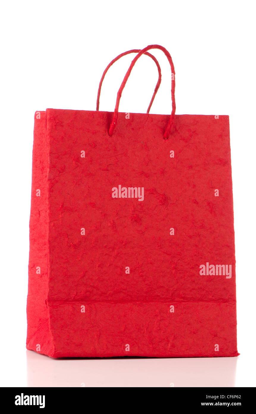 Red paper bag over white background Stock Photo - Alamy