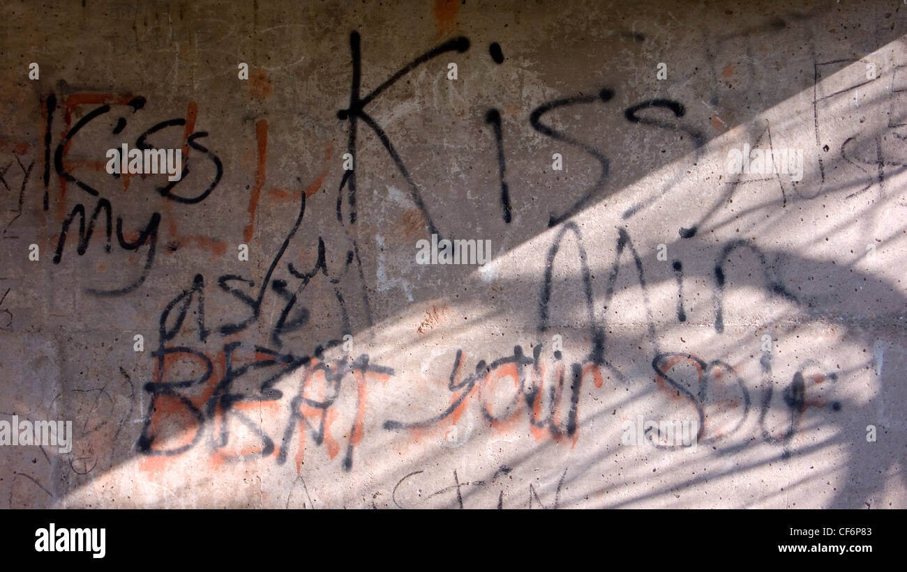 Naughty graffiti writing on wall with shadow Stock Photo - Alamy