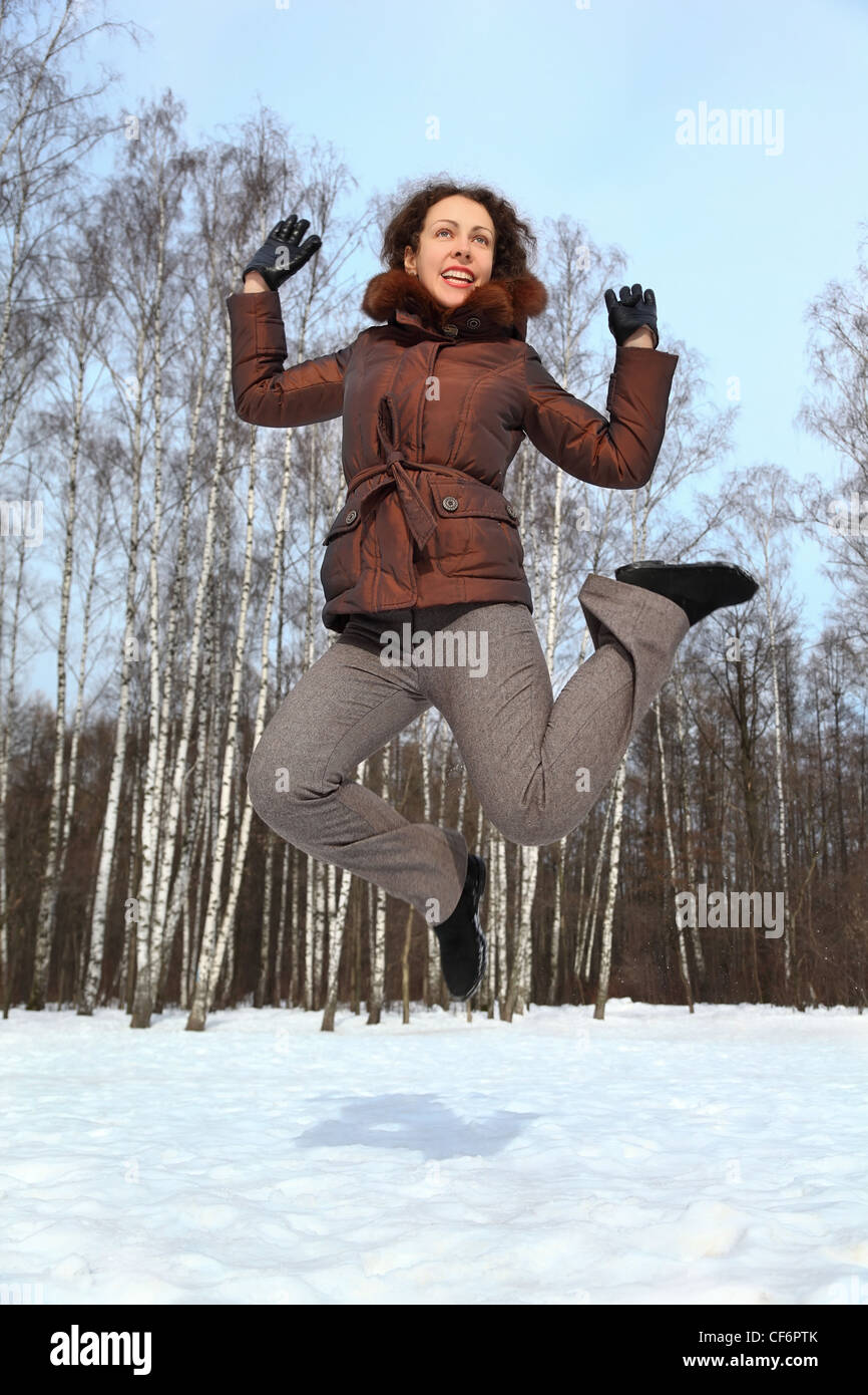 Woman jumps up to sky, sends hands and feet upwards Stock Photo - Alamy