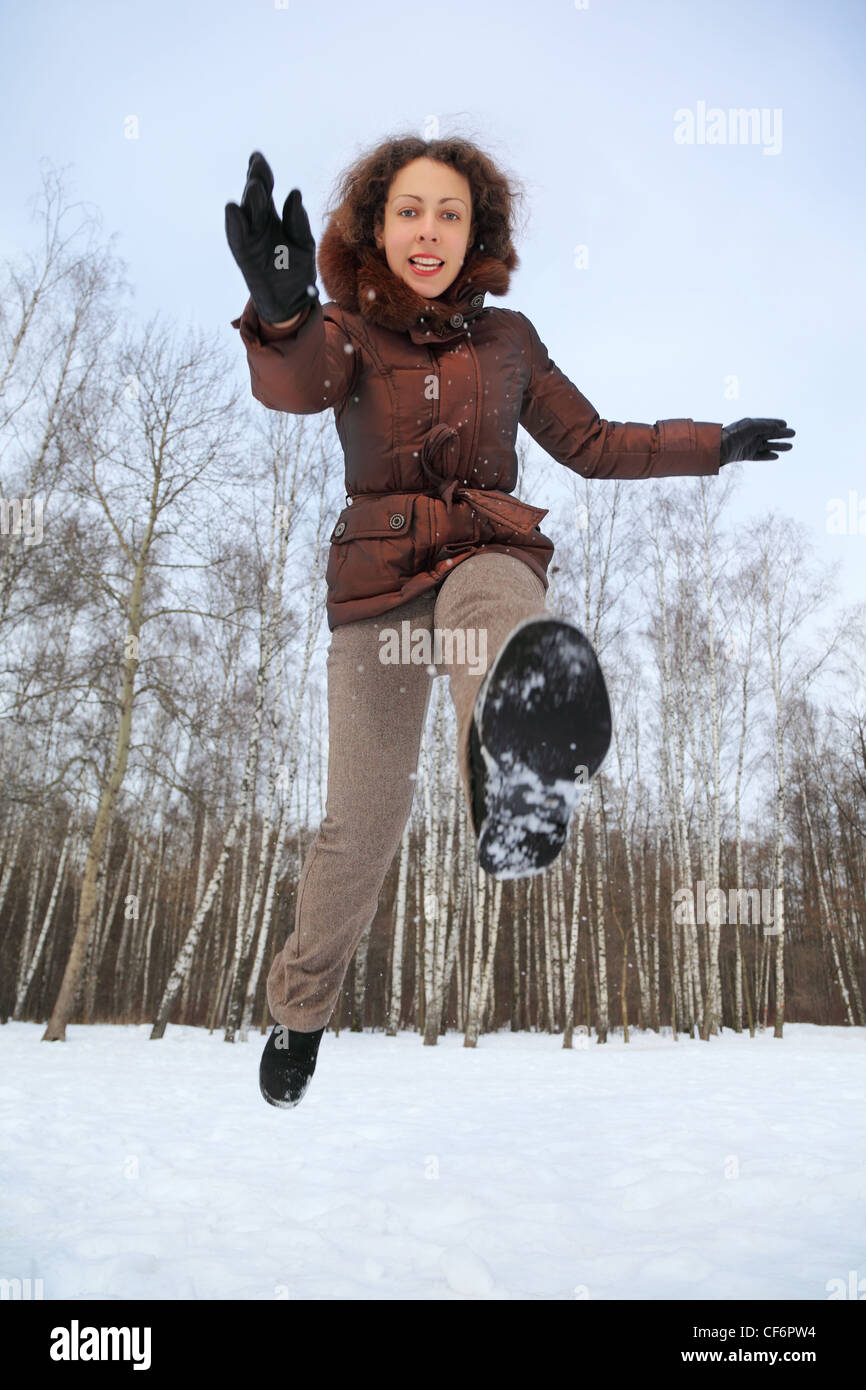 Woman jumps forward, pushing slightly itself one leg Stock Photo - Alamy