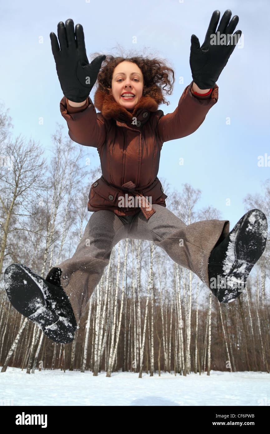 Woman jumps forward, pushing slightly itself by feet and hands Stock ...