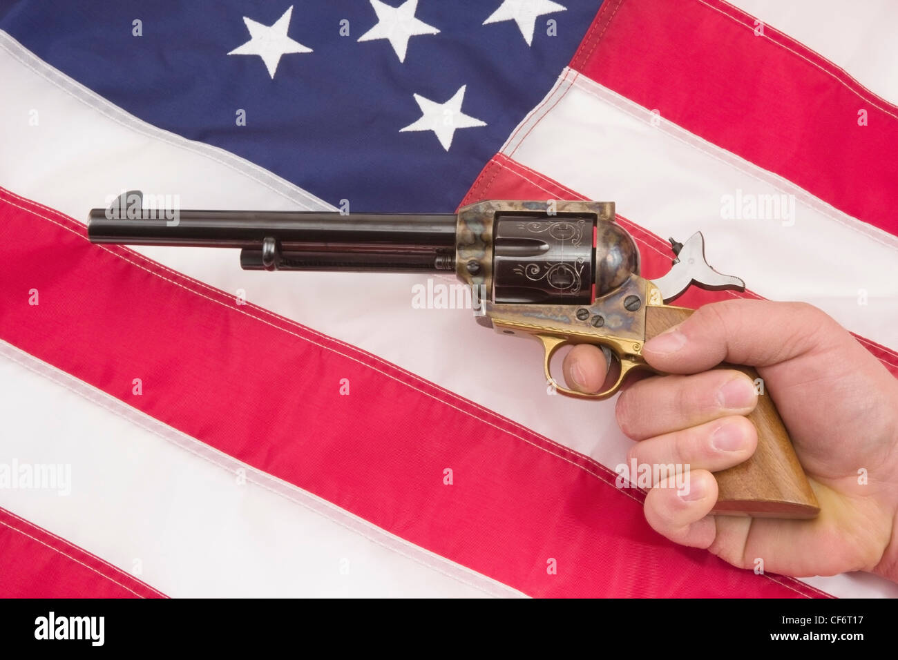 Human hand shooting antique pistol with American Flag background Stock ...