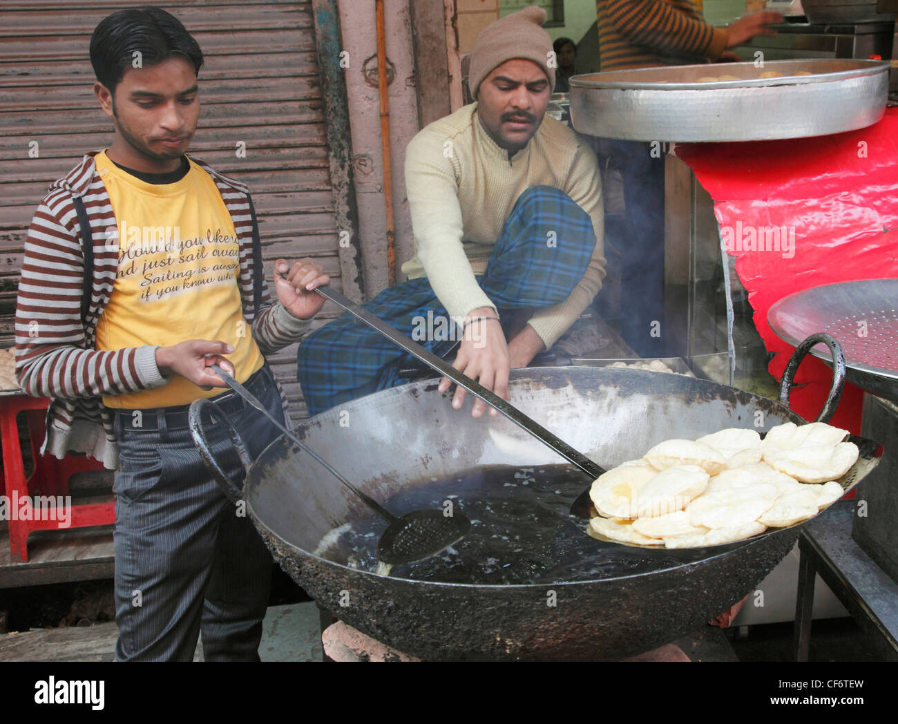 India, Delhi, Old Delhi, street food, people frying puri bread Stock ...
