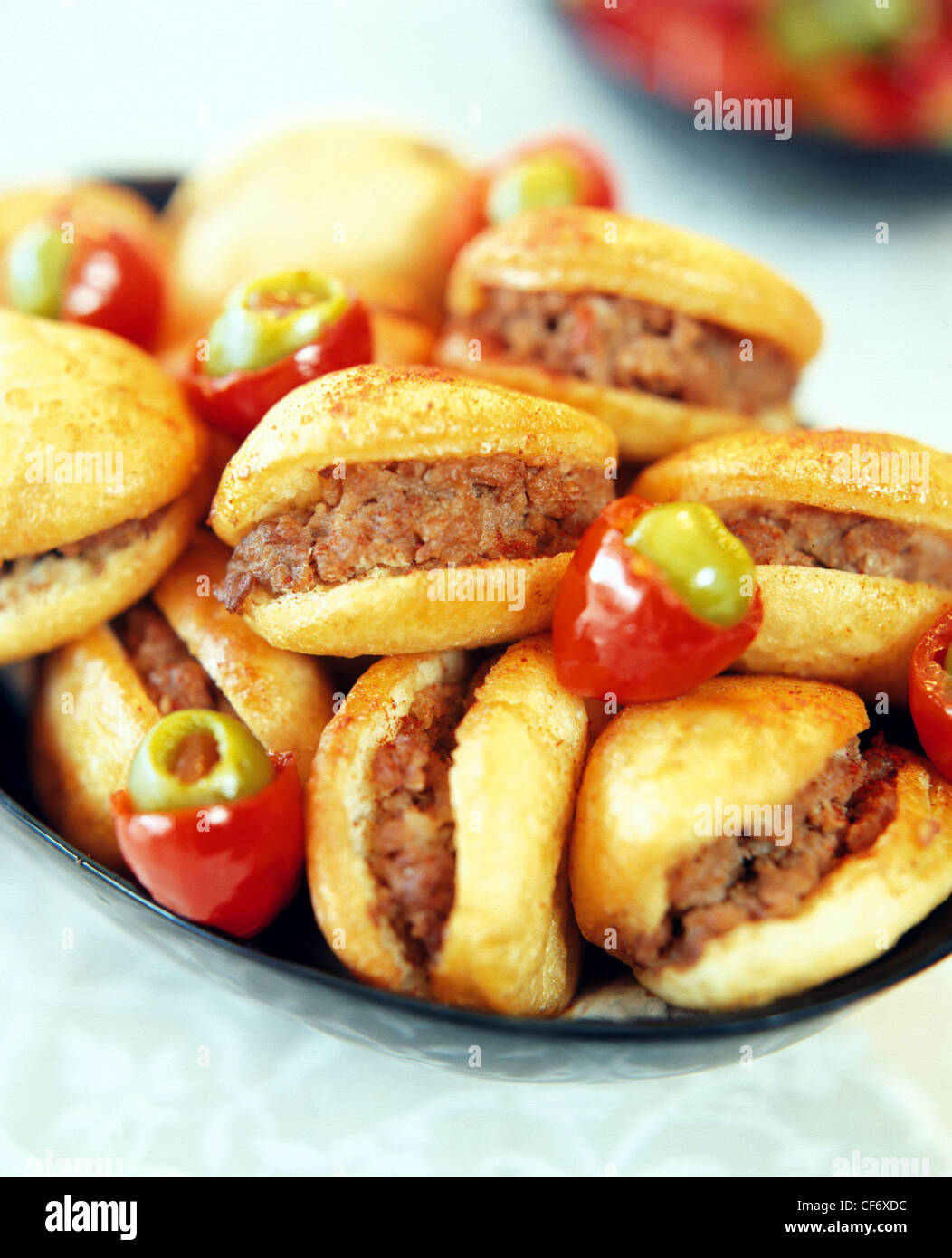 c "Tasteful entertaining" Mini Vetkoek with savoury mince Stock Photo ...