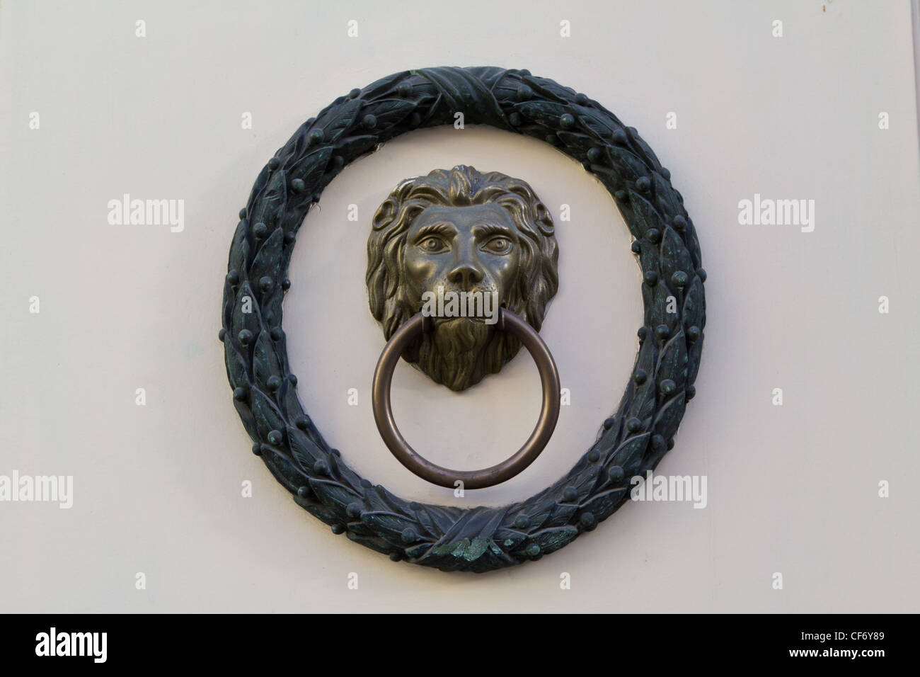 A bronze lion head with a ring on a wall in Vienna Stock Photo - Alamy
