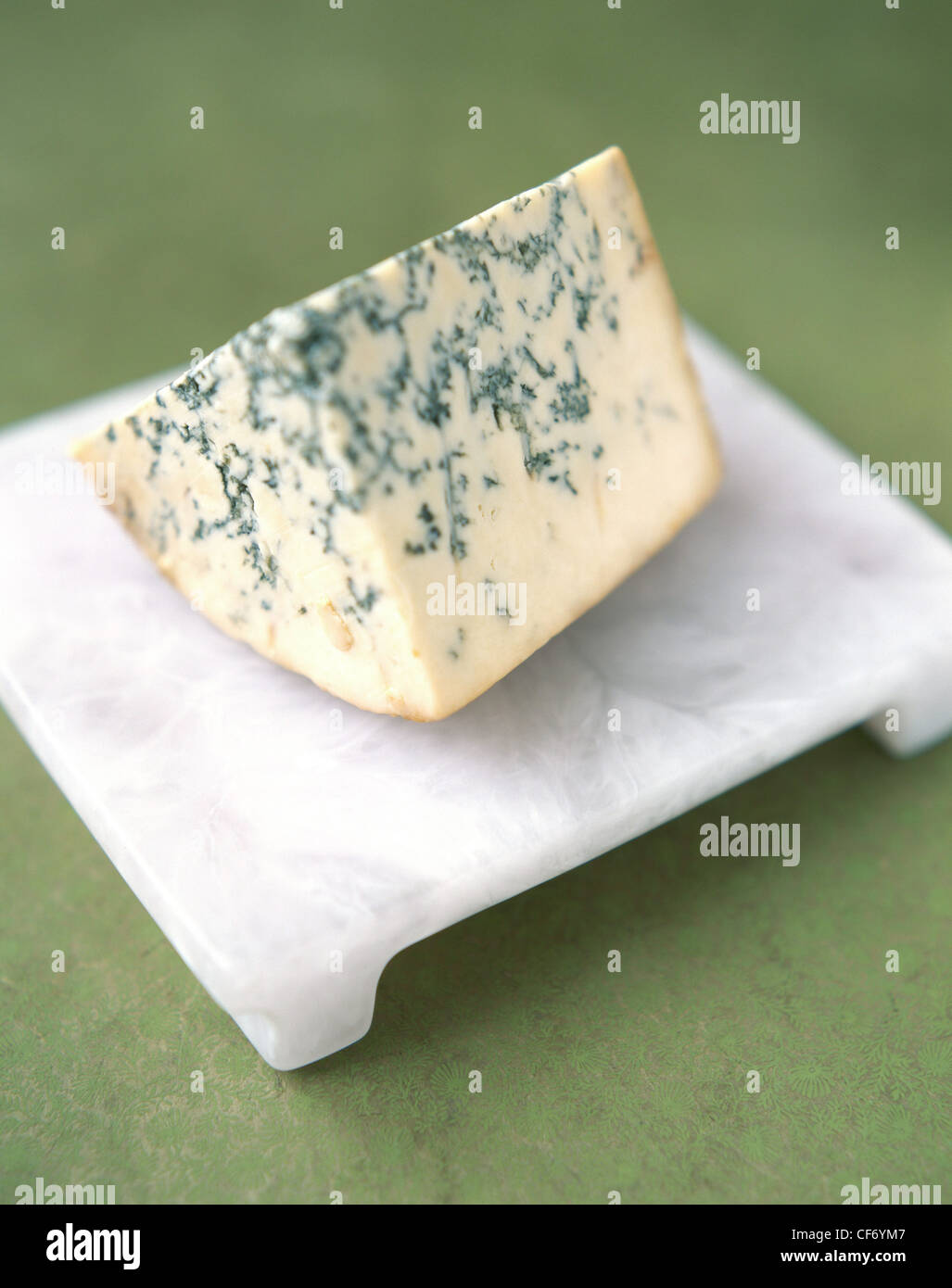 A wedge of blue cheese on a marble cheese board Stock Photo - Alamy