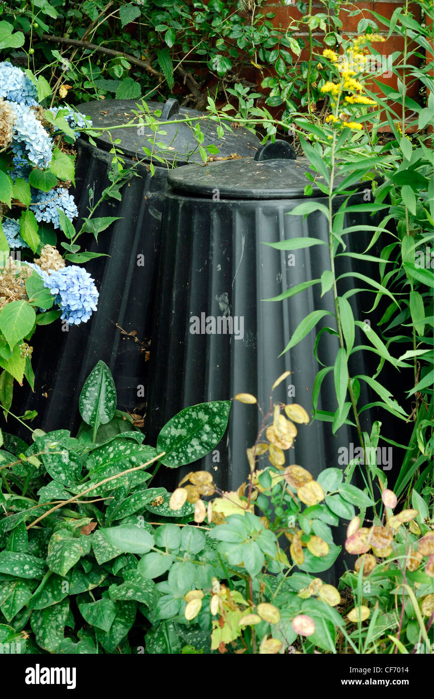 Compost bins in a garden Stock Photo - Alamy