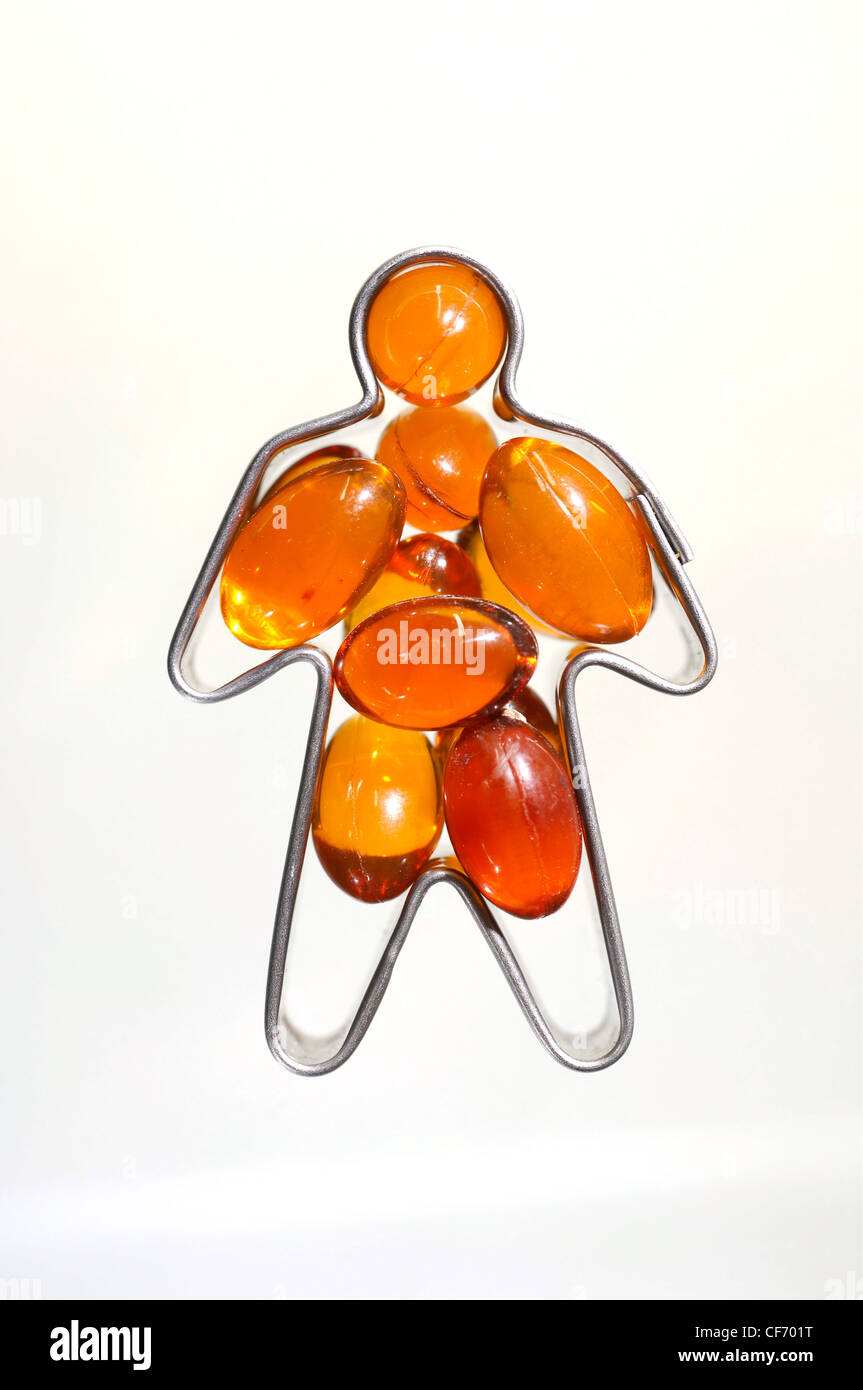 Metal gingerbread man cutter with yellow clear capsules inside Stock ...