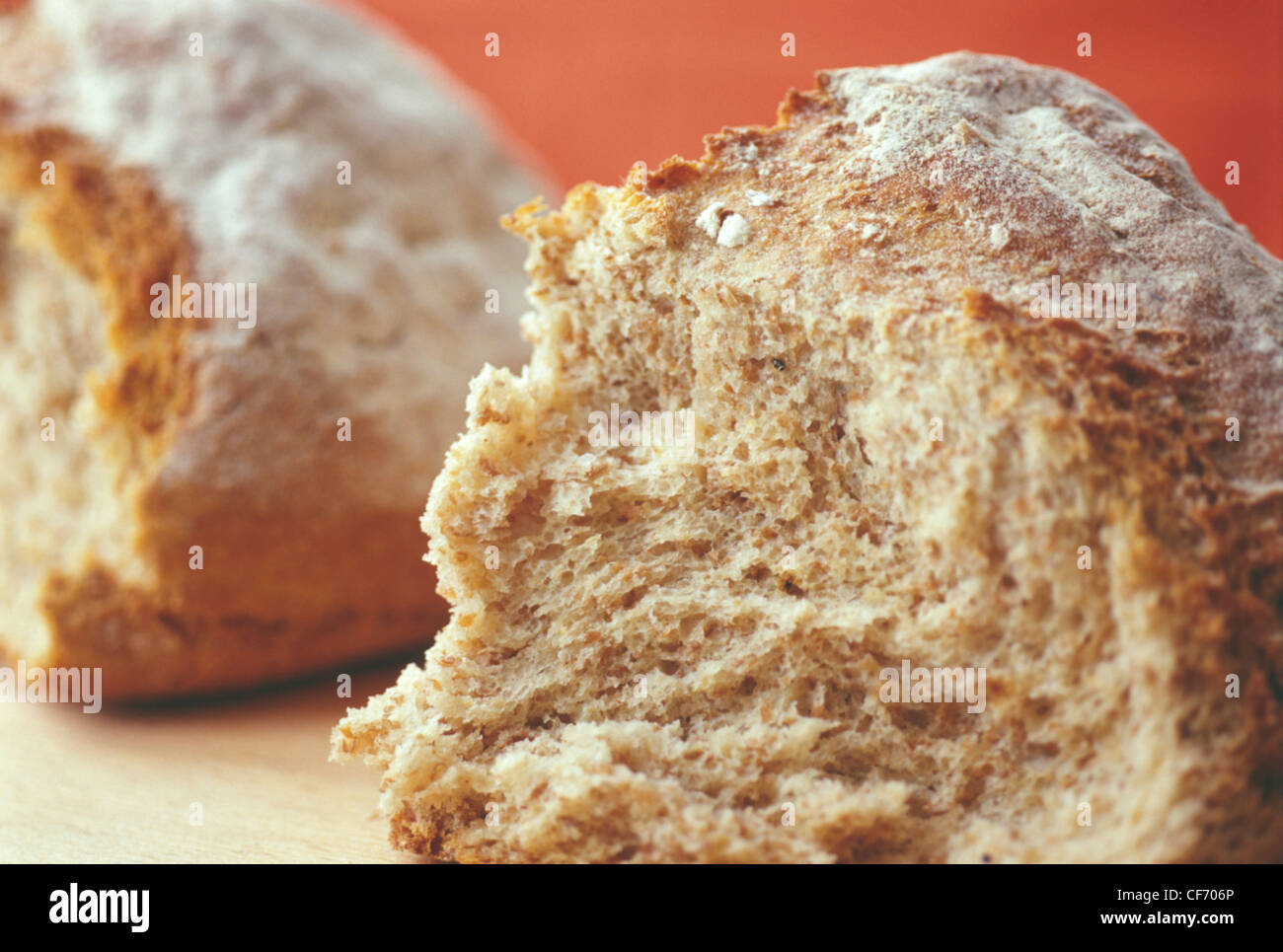 CX1887101 Close up of a brown bread roll broken in half Stock Photo - Alamy