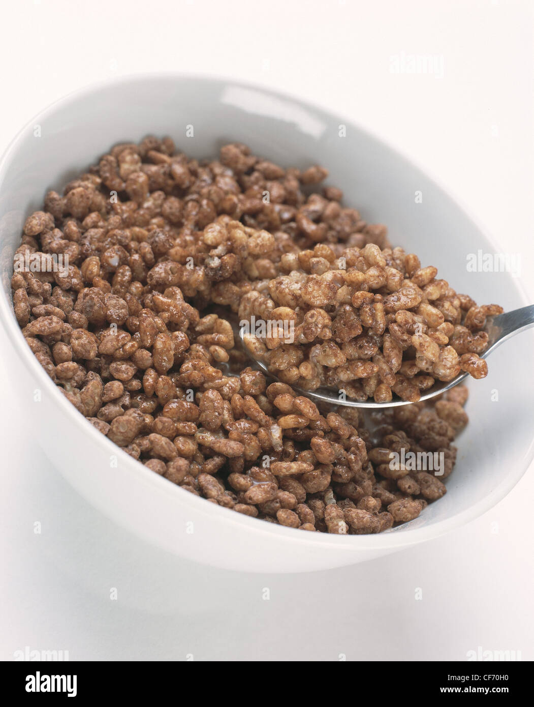 White china cereal bowl of coco pops with spoon Stock Photo - Alamy