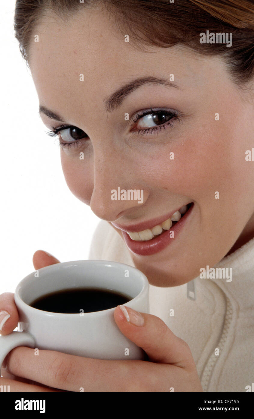 Female drinking coffee Stock Photo - Alamy