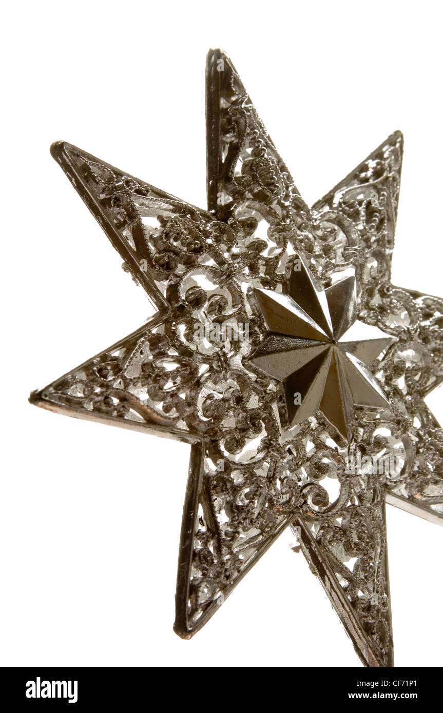 Silver star shaped Christmas tree topper decoration Stock Photo - Alamy