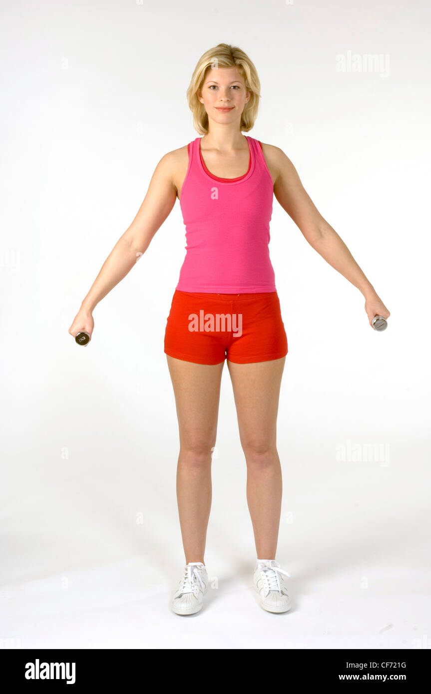 Female lifting hand weights Stock Photo - Alamy