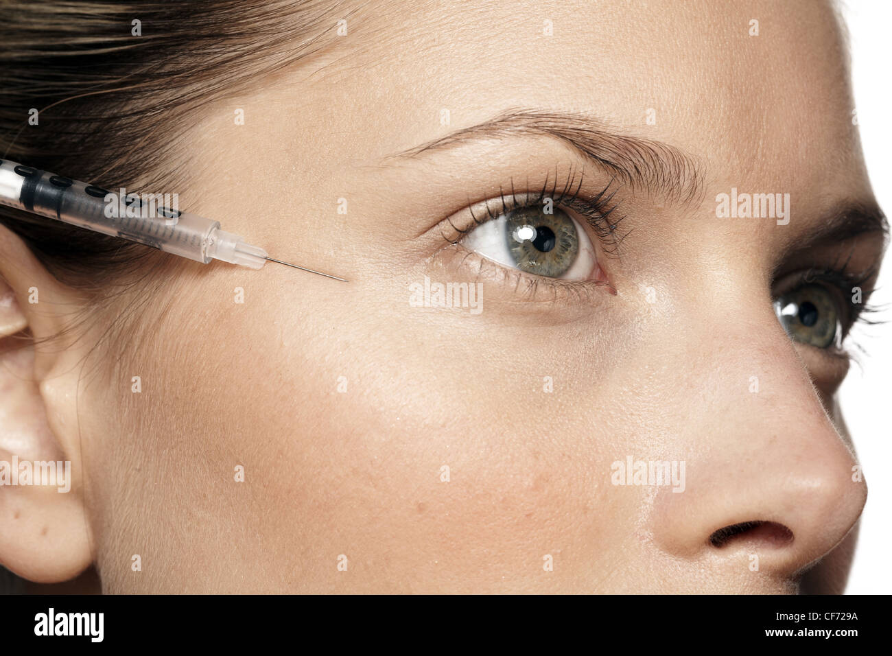 Female having botox injection below eye Stock Photo - Alamy