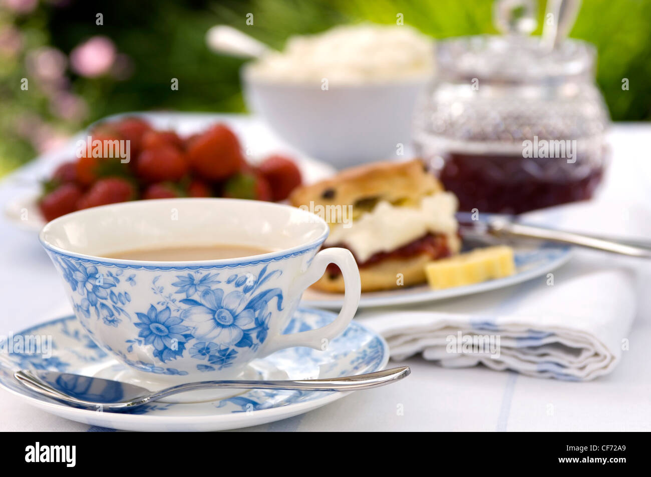 An English cream tea Cup of tea, scone with butter jam and cream Stock ...