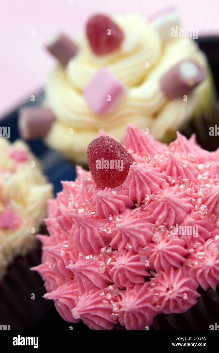 An English cream tea Cupcakes decorated with icing and sprinkles Stock ...