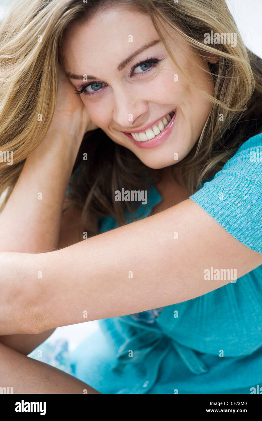 Female with head resting on hand Stock Photo - Alamy