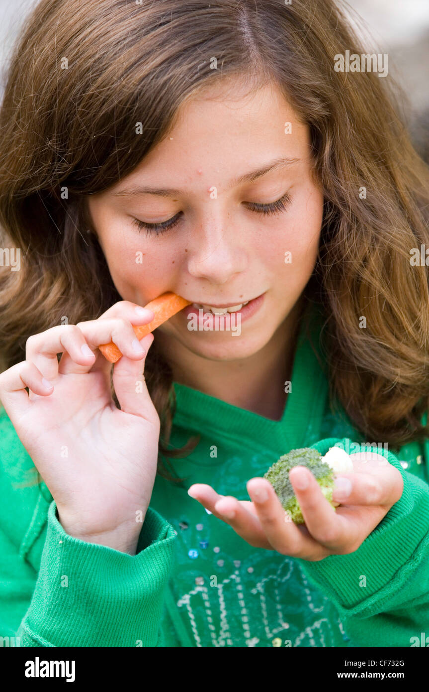 Teenager girl eating carrot hi-res stock photography and images - Alamy