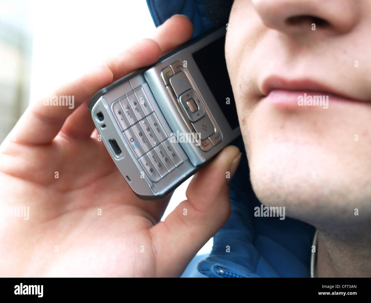 Male talking on a mobile phone Stock Photo - Alamy