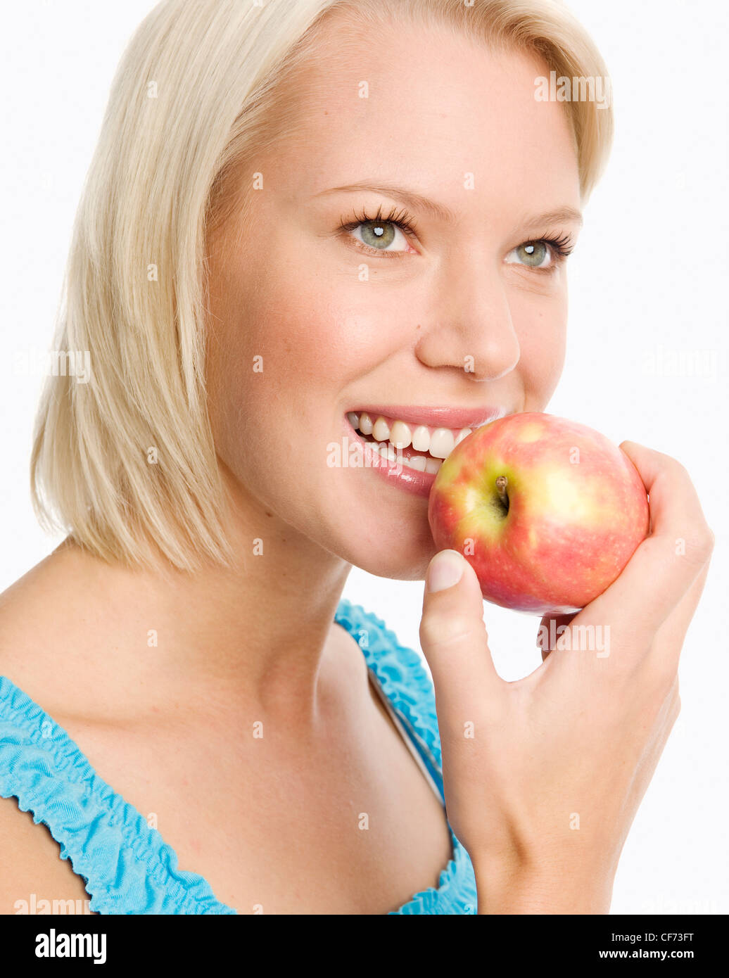 Female biting an apple Stock Photo - Alamy