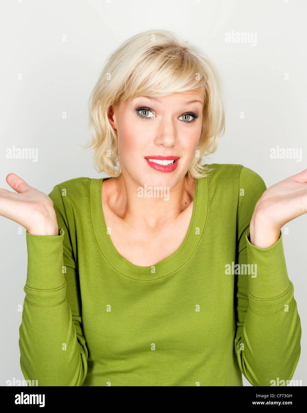 Woman shrugging shoulders indoors hi-res stock photography and images ...