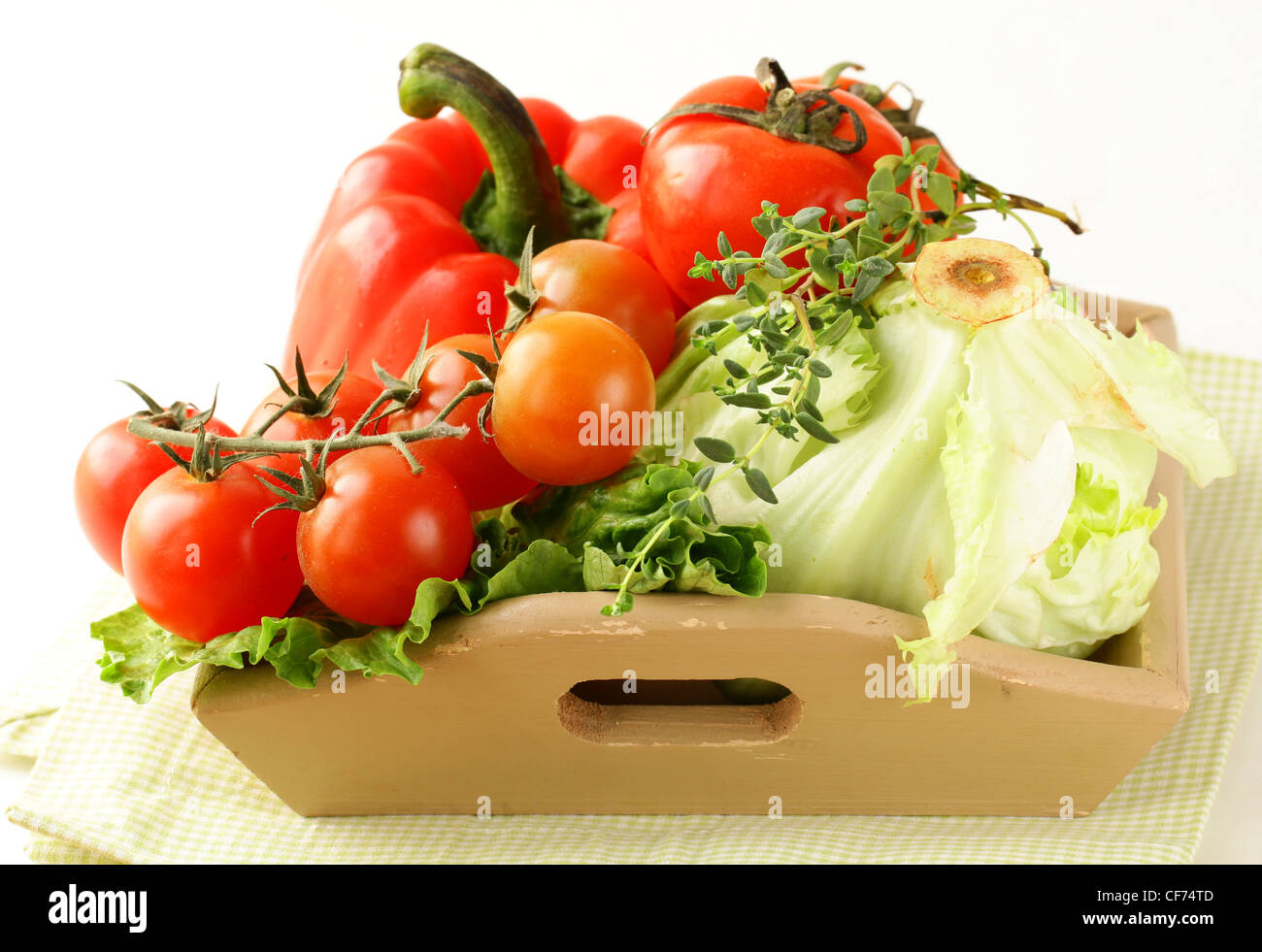 Different fresh vegetables in a wooden bowl Stock Photo - Alamy