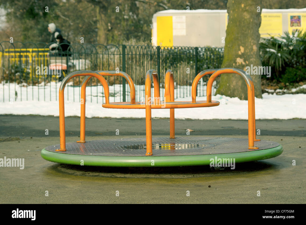 Traditional roundabout in children's playground at Finsbury Park ...